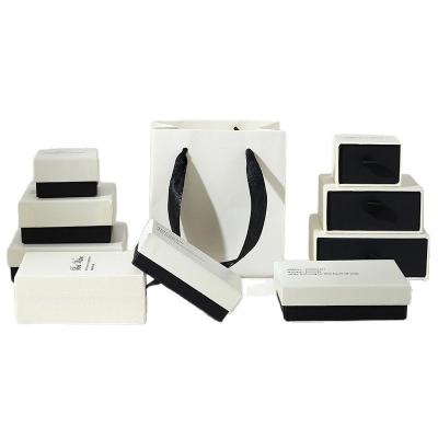 China Customized Logo Jewelry Box With White And Black Lid Ring Packaging Box And Gift Box for sale