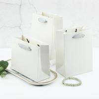 China Off-White Paper Bags For Jewelry Packaging Custom Birthday And Holiday Gift Bags With Logo Printing for sale