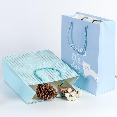 China Large Vertical Cartoon Gift Bag Birthday Gift Packaging Paper Bag Shopping Clothes Bag for sale