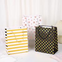 China Hot Stamping Polka Dot Paper Bag Thick White Cardboard Handbag Shopping Gift Bag Gift Packaging for sale