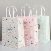 China Cartoon Clothing Bag Gift Packaging Bag Shopping Tote Bag White Cowhide Custom Gift Bag Paper Bag for sale