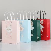China Customized Clothing Paper Bag Packaging Bag Fashion Shopping Tote Bag White Cowhide Tote Bag for sale