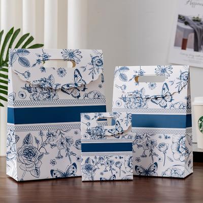 China Floral Gift Bag Collection Premium Blue Red Flower Butterfly Design Holiday Celebration Packaging for sale
