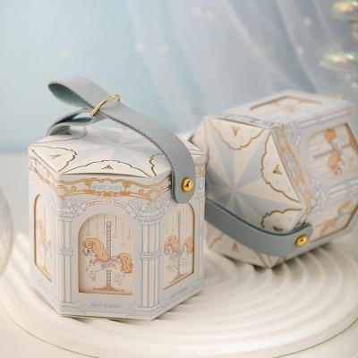 China Carousel Romance Candy Box Set European Hexagonal Wedding Favor Packaging Gold Foil Carousel Design Leather Handle for sale