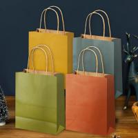 China Solid Color Kraft Paper Tote Bag Baking Takeaway Packaging Bag Customized Logo Clothing Packaging Paper Bag for sale