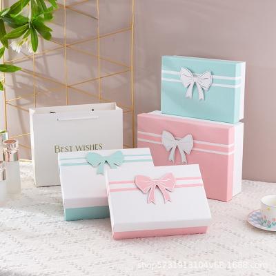 China Sky Lid Gift Box Set Long Rectangular Cosmetics Scarf Packaging Bow Accent Design Premium Cardboard Boxes for sale