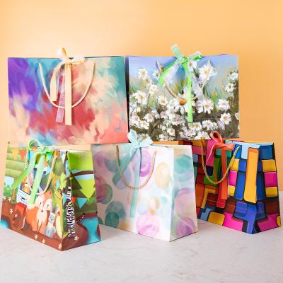 China Oil Painting Style Gift Packaging Bags Clothing Store Gift Bags Custom Printed Paper Bags Wholesale for sale