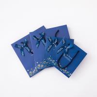 China Cardboard Gift Bag Jewelry Themed Paper Bag With Bowknot And Floral Patterns Ideal For Handbags Gift Returns And Shopping for sale