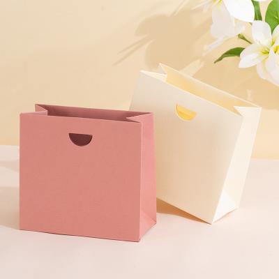China Simple Paper Bag Handbag Gift Packaging Bag Jewelry Gift Hard Bottom Tote Paper Bag for sale