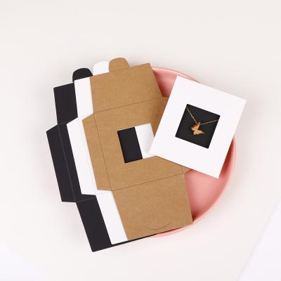 China Hollow Wrapping Paper Cardboard Jewelry Bag Display Card Box Jewelry Cardboard Box for sale
