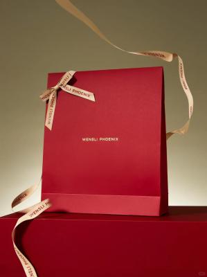 China Luxury Gift Bag Premium Red Gold Branded Packaging Satin Ribbon Handle Luxury Brand Presentation for sale