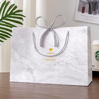 China Marble Gift Bags Premium Ribbon Handled Packaging Instagram Aesthetic Luxury Tote Holiday Clothing Presentation Bags for sale