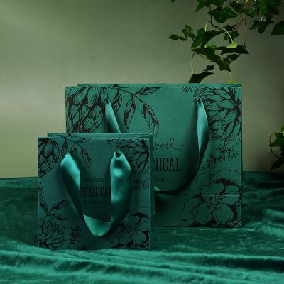 China Hand Drawn Botanical Gift Bags Eco Friendly Wedding Favor Packaging Satin Ribbon Handles Plant Patterned Party Favor Bags for sale