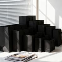 China Black Cardboard Bag Custom Paper Tote Packaging Bag Black Kraft Paper Bag Clothing Store Tote Bag for sale