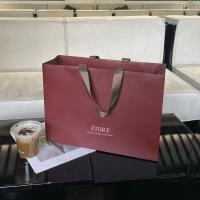 China New Kraft Paper Bag Clothing Store Handbag Packing Gift Gift Bag Packaging Shopping Belt Wholesale for sale