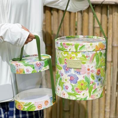 China Floral Cylinder Gift Box Set Elegant Wedding Favor Buckets Green Handle Party Favors for sale