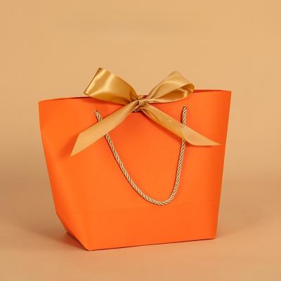 China Premium Fashion Shopping Bag Luxury Ribbon Accented Gift Packaging Twisted Rope Handles for sale