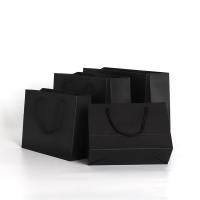 China Black Gift Bags Paper Bags Clothing Tote Bags Wholesale Black Cardboard Bags With Logo Printing for sale