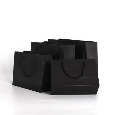China Black Gift Bags Paper Bags Clothing Tote Bags Wholesale Black Cardboard Bags With Logo Printing for sale