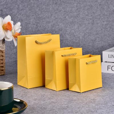 China Thickened White Cardboard Bags Gift Bags Clothing Store Tote Bags Custom Advertising Paper Bags for sale