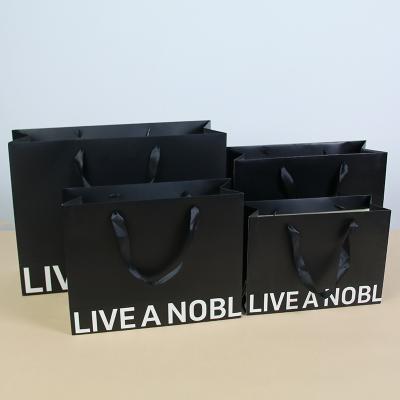 China Thickened Kraft Paper White Cardstock Gift Bags Clothing Store Tote Bags Custom Logo Printing Packaging Bags for sale