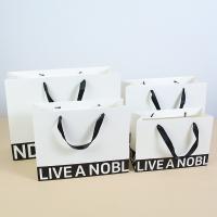 China Thickened Kraft Paper White Cardstock Gift Bags Clothing Store Tote Bags Custom Logo Printing Packaging Bags for sale