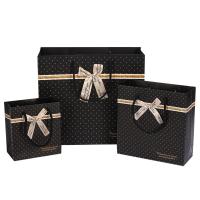 China Black Kraft Paper Bag Clothing Store Ribbon-decorated Packaging Tote Bag Gift Wrapping Handbag for sale