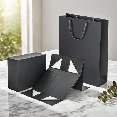 China Black Minimalist Gift Box Shopping Bag Set Premium Matte Cardboard Packaging with Silver Rope Handles Ideal for Luxury Gifts Stylish Durable for sale