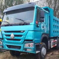 China used dump truck HOWO tractor truck SINOTRK 371HP red yellow for sale