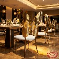 China WENDING Gold Butterfly Wing-Back Dining Chair – Art Deco Wedding Banquet Chair for sale