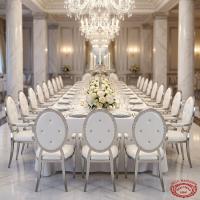 China WENDING Silver Stud-Rim Oval Armchair – White PU Leather Hotel Banquet Dining Chair for sale
