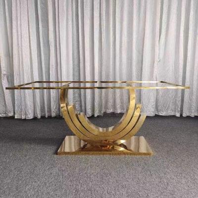 China WENDING Gold Multi-Arc Rainbow U-Base Glass Dining Table – Sculptural Hotel Banquet Table for sale