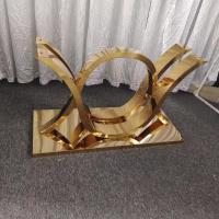 China WENDING Gold Wing-and-Ring Sculptural Base Marble Dining Table – Art Object Hotel Table for sale