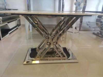 China WENDING Gold X-Twist Arc-Tube Central Base Marble Dining Table – Sculptural Hotel Table for sale