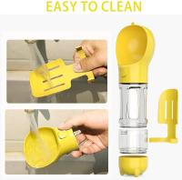 China Multifunctional 2 In 1 Dog Portable Puppy Water Bottle With Food Box Shovel Garbage Bags for sale