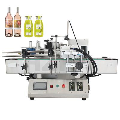 China Automatic Table Type Small Essential Oil Round Bottle Sticker Labeling Machine for sale