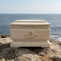 China Casket Style Biodegradable Cremation Urns Soft Stone Look Eco Friendly Burial Urns for sale
