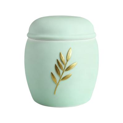 China Mint Green Ceramic Cremation Urn Custom Shape Memorial Urn With Gold Leaf for sale