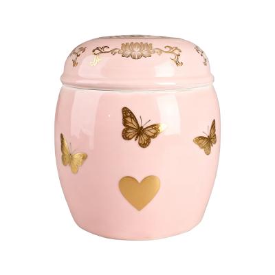 China Ceramic Funeral Urns Supplier Pink Glaze Gold Detail for sale
