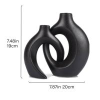 China Embrace Hollow Ceramic Vase for Modern Home Decor for sale