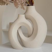 China Embrace Hollow Ceramic Vase for Modern Home Decor for sale