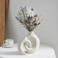 China Embrace Hollow Ceramic Vase for Modern Home Decor for sale