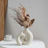 China Embrace Hollow Ceramic Vase for Modern Home Decor for sale