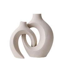 China Embrace Hollow Ceramic Vase for Modern Home Decor for sale