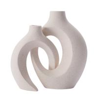 China Embrace Hollow Ceramic Vase for Modern Home Decor for sale