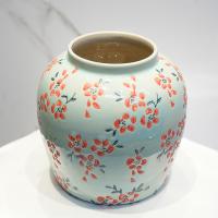 China Glossy Green Ceramic Urn with Floral Berry Motif for sale