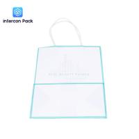 China 120gsm White Flat Bottom Paper Bags Bioldegradable Shopping Paper Bags With Logo for sale