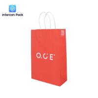 China 210g Twisted Handle Kraft Paper Bags Red Color Printing 12.99x8.66x3.94 inch for sale