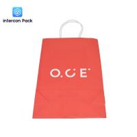 China 210g Twisted Handle Kraft Paper Bags Red Color Printing 12.99x8.66x3.94 inch for sale