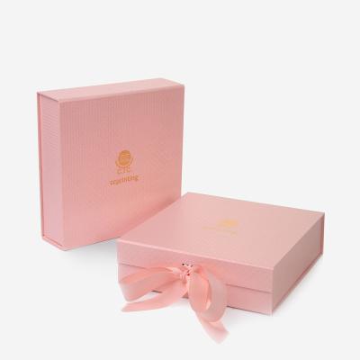 China Pink Magnetic C1S C2S Foldable Packaging Box With Ribbon Closure for sale